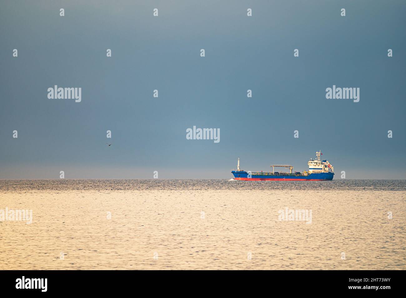 Huge ship sailing in the English Channel, France against the clear blue ...