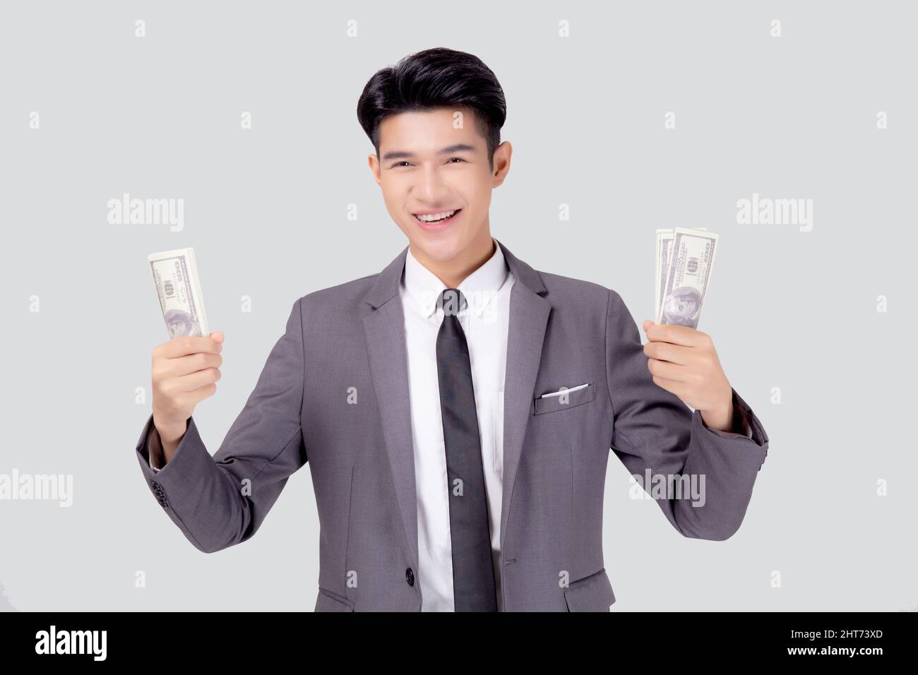 Young asian business man holding money dollar isolated on white ...
