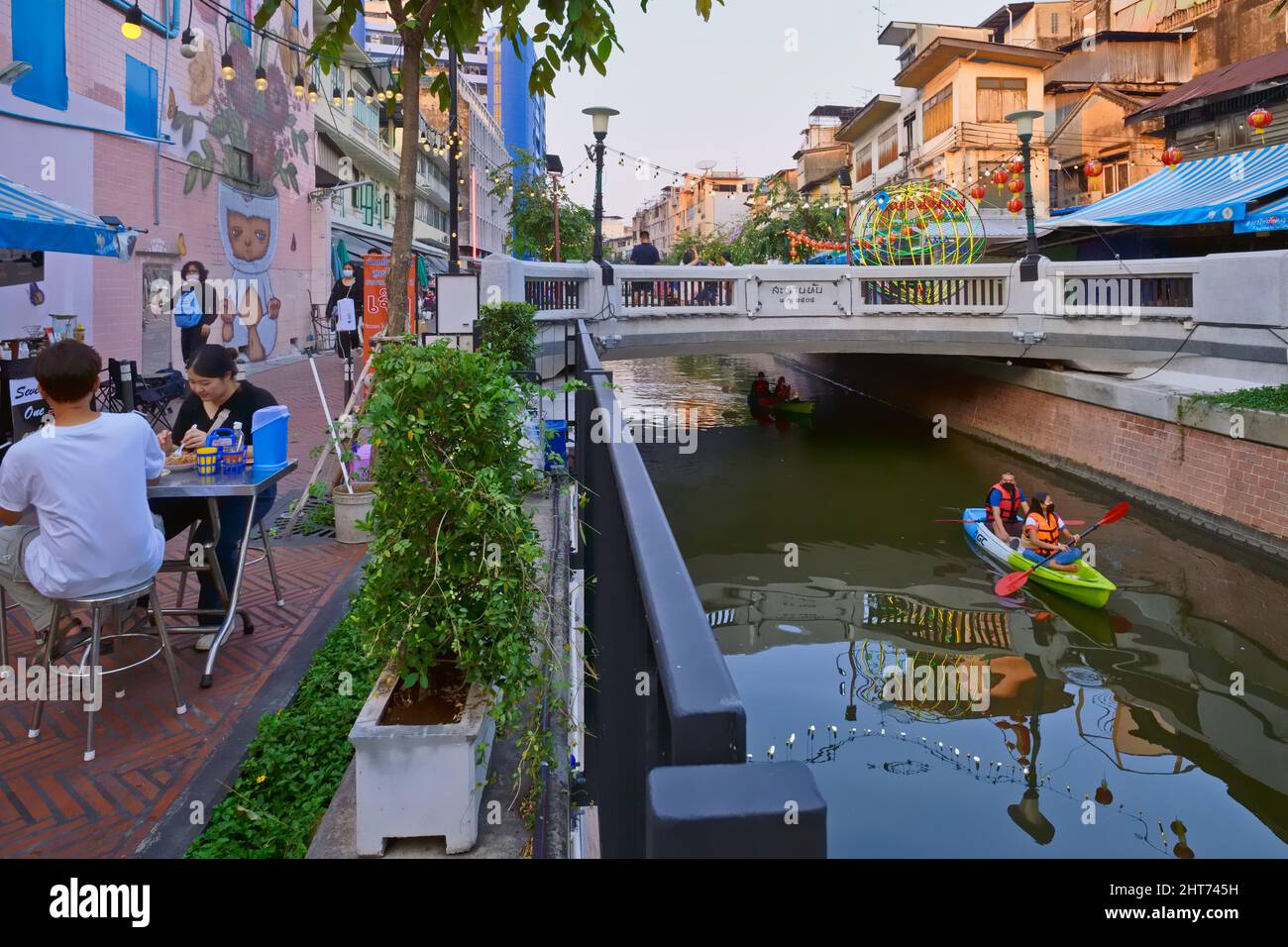 Sightseers kayaking on Klong Ong Ang in Bangkok, Thailand, a canal ...
