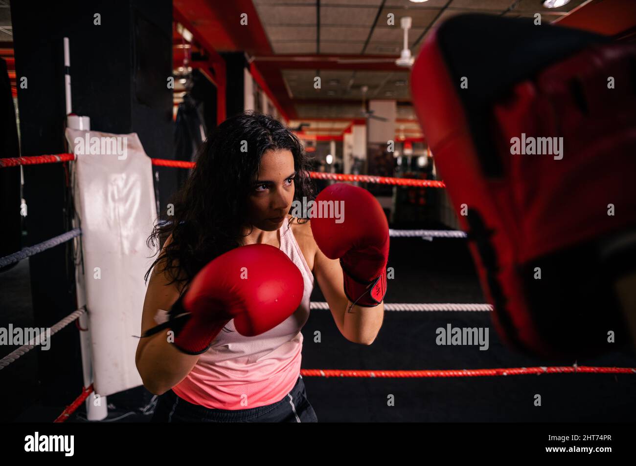 Young Caucasian girl training in a boxing ring Stock Photo - Alamy