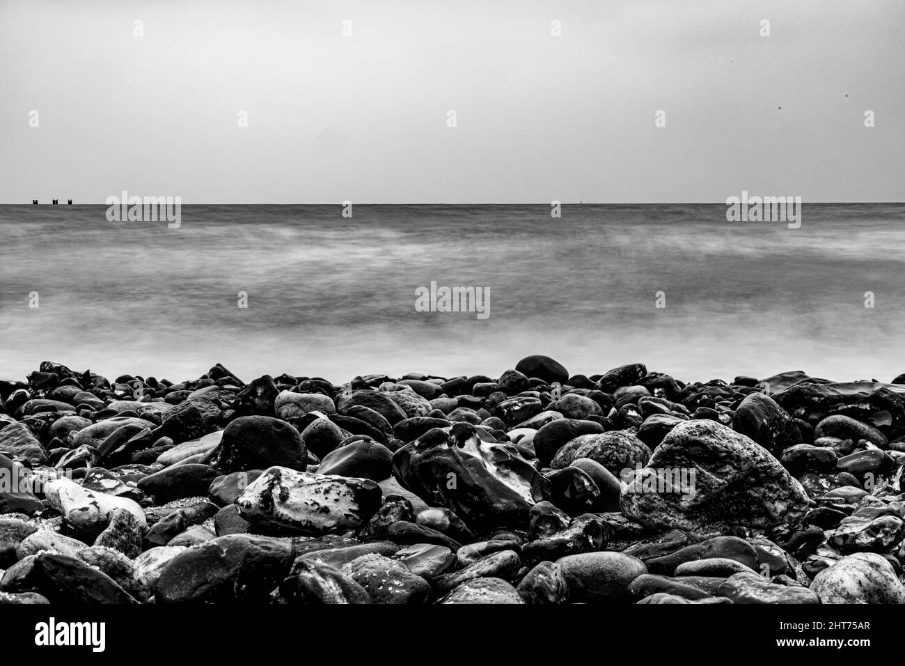 Grayscale of rocky coast in Germany Stock Photo - Alamy