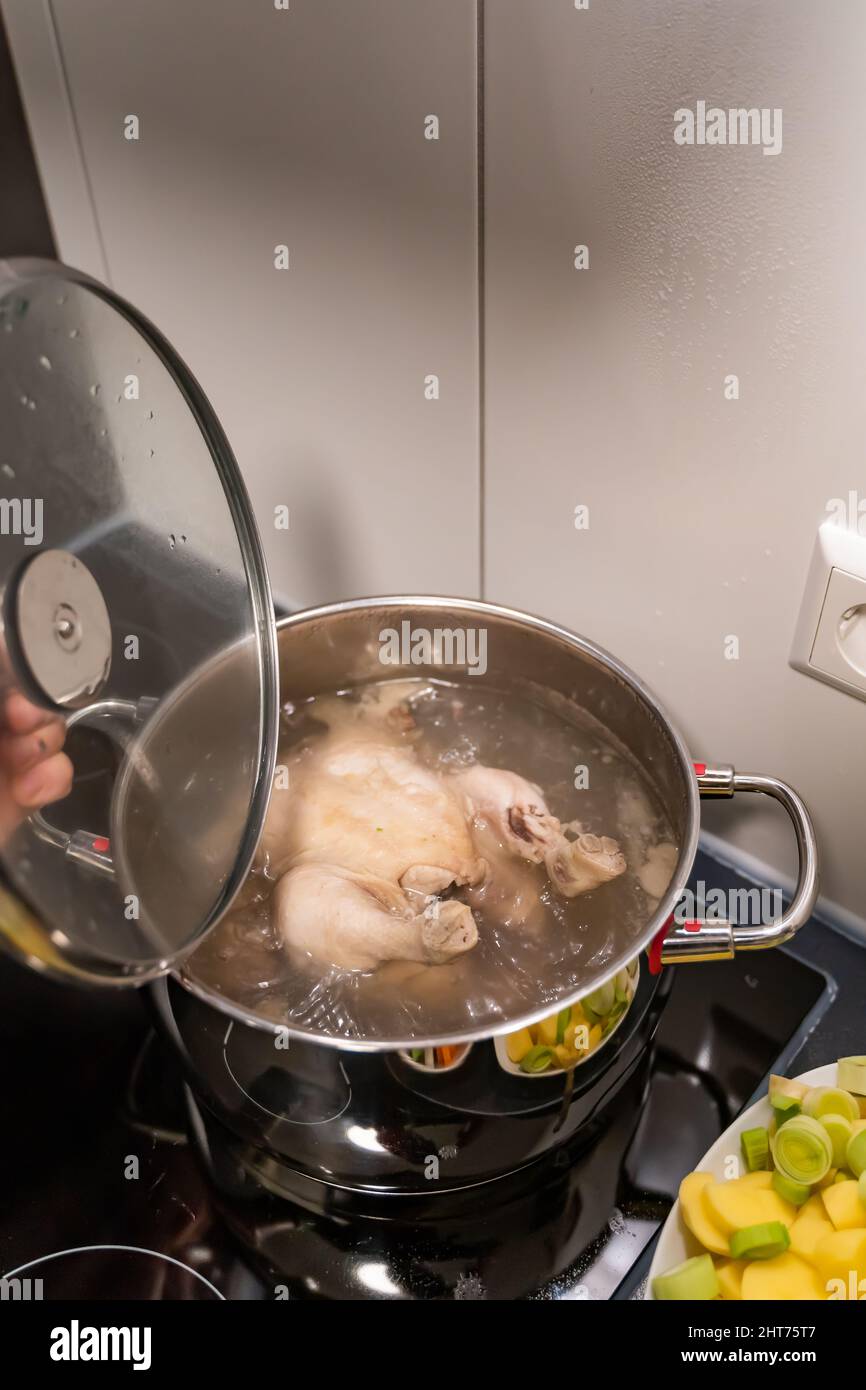 Closeup shot of a chicken cooked in a saucepan Stock Photo - Alamy