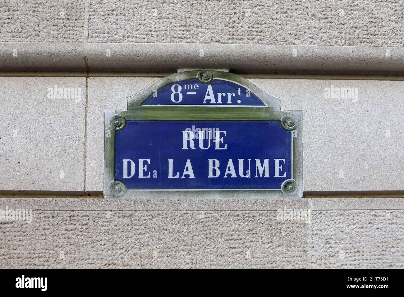 Closeup shot of the Paris street plates name on the Haussmann building ...