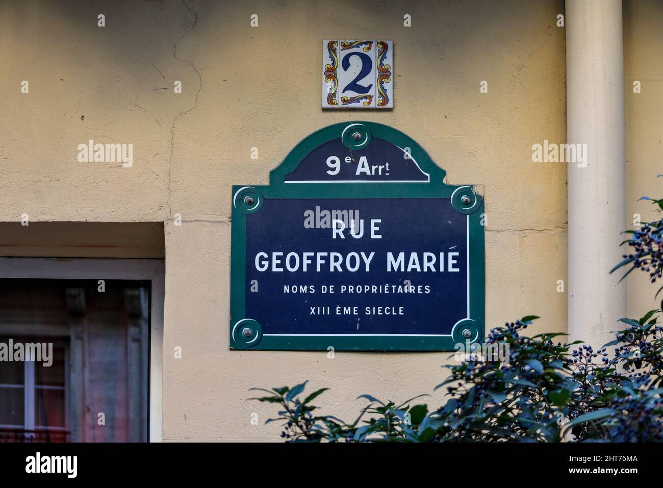 Photo of a typical street name plate on a building facade in Paris ...