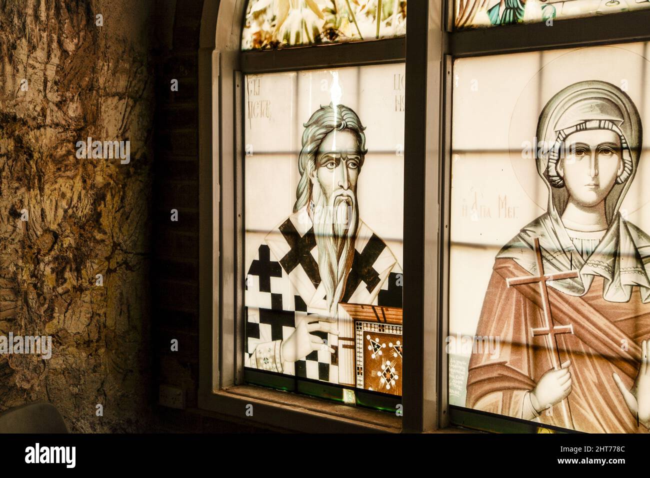 View of stained glass window with saints Stock Photo - Alamy