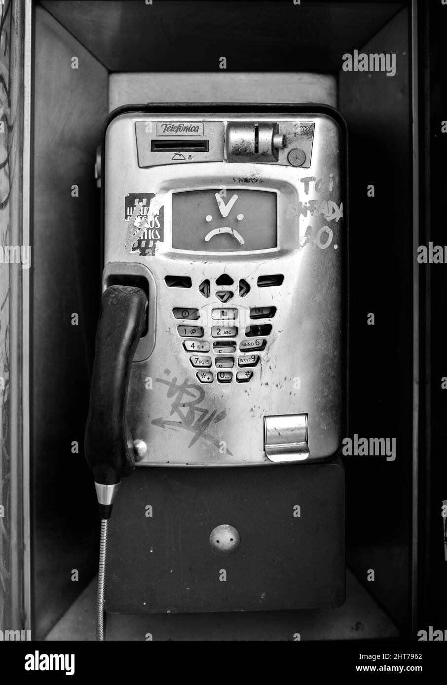 Grayscale of an old telephone outside Stock Photo - Alamy