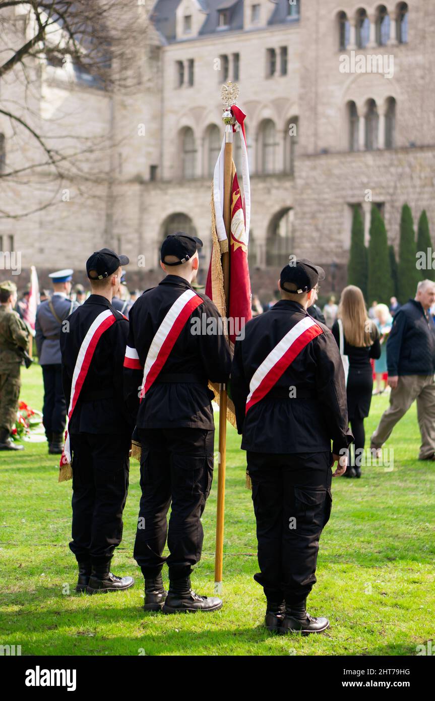 Vertical shot of a group of soldiers having a ceremony in the garden of ...