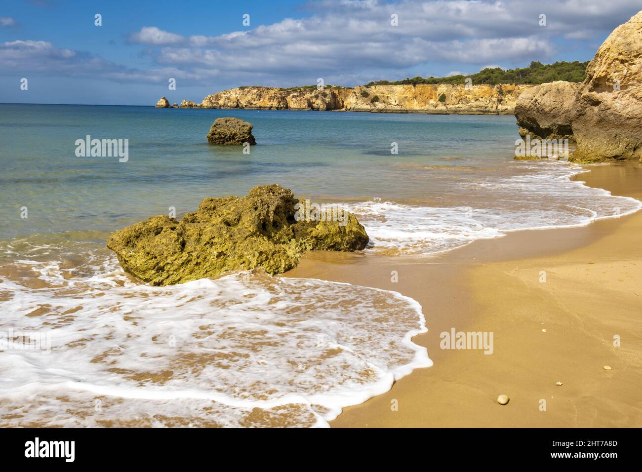 Scenic golden cliffs in the Praia do Vau beach in Portimao, Algarve ...
