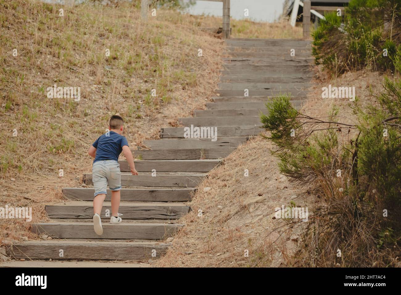 Closeup of a boy running outside Stock Photo - Alamy