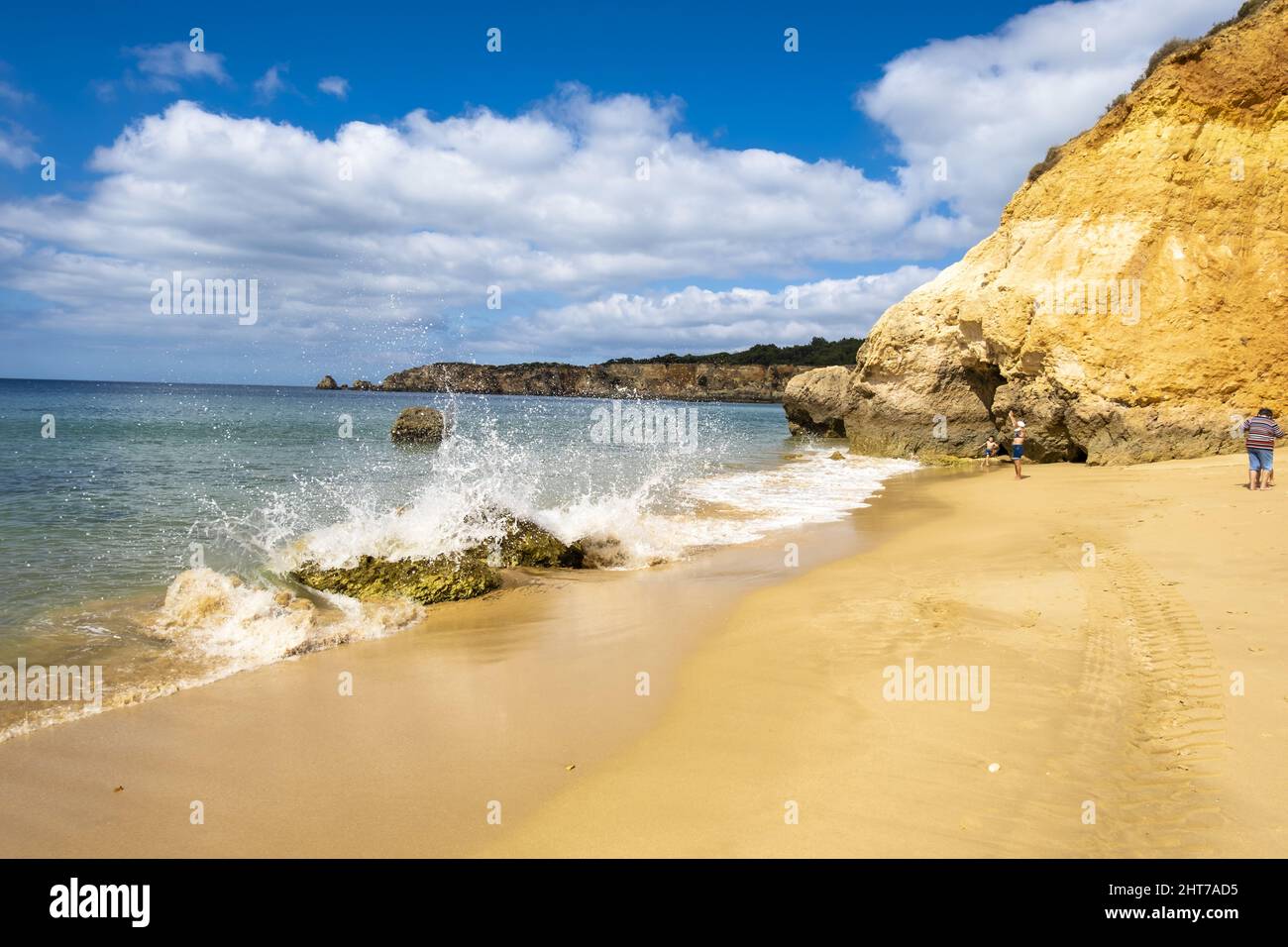 Scenic golden cliffs in the Praia do Vau beach in Portimao, Algarve ...