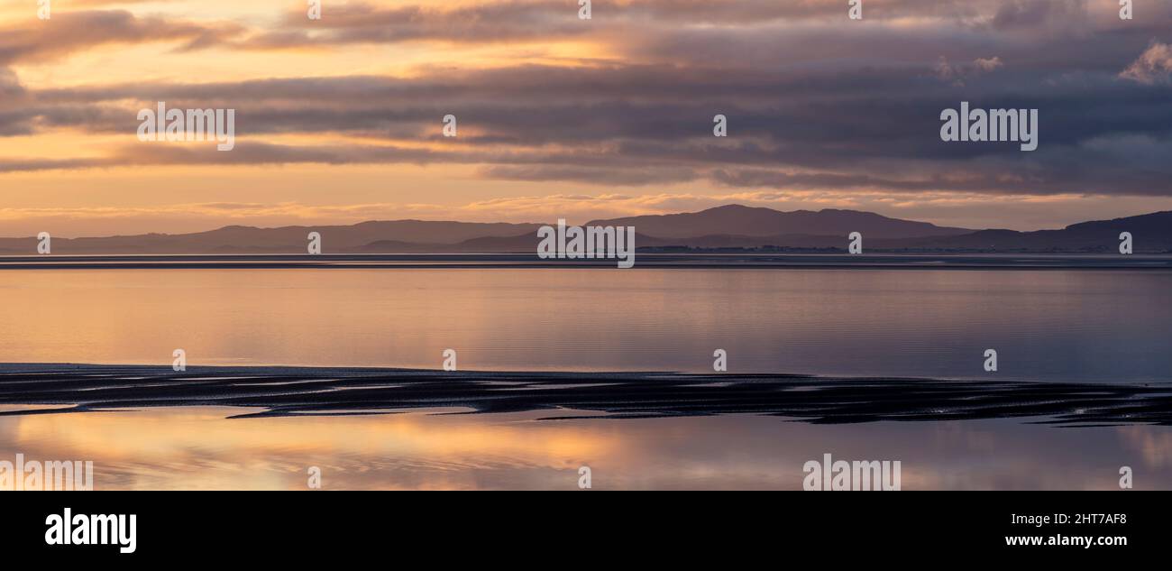 Epic sunset landscape image of Solway Firth viewed from Silloth during ...