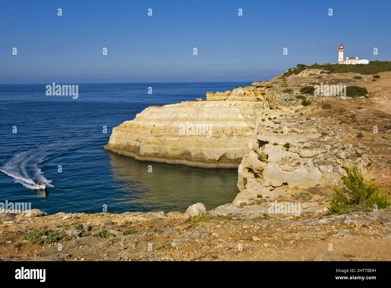 yellow cliff, sand and clear water at the Carvalho cape, Algarve ...