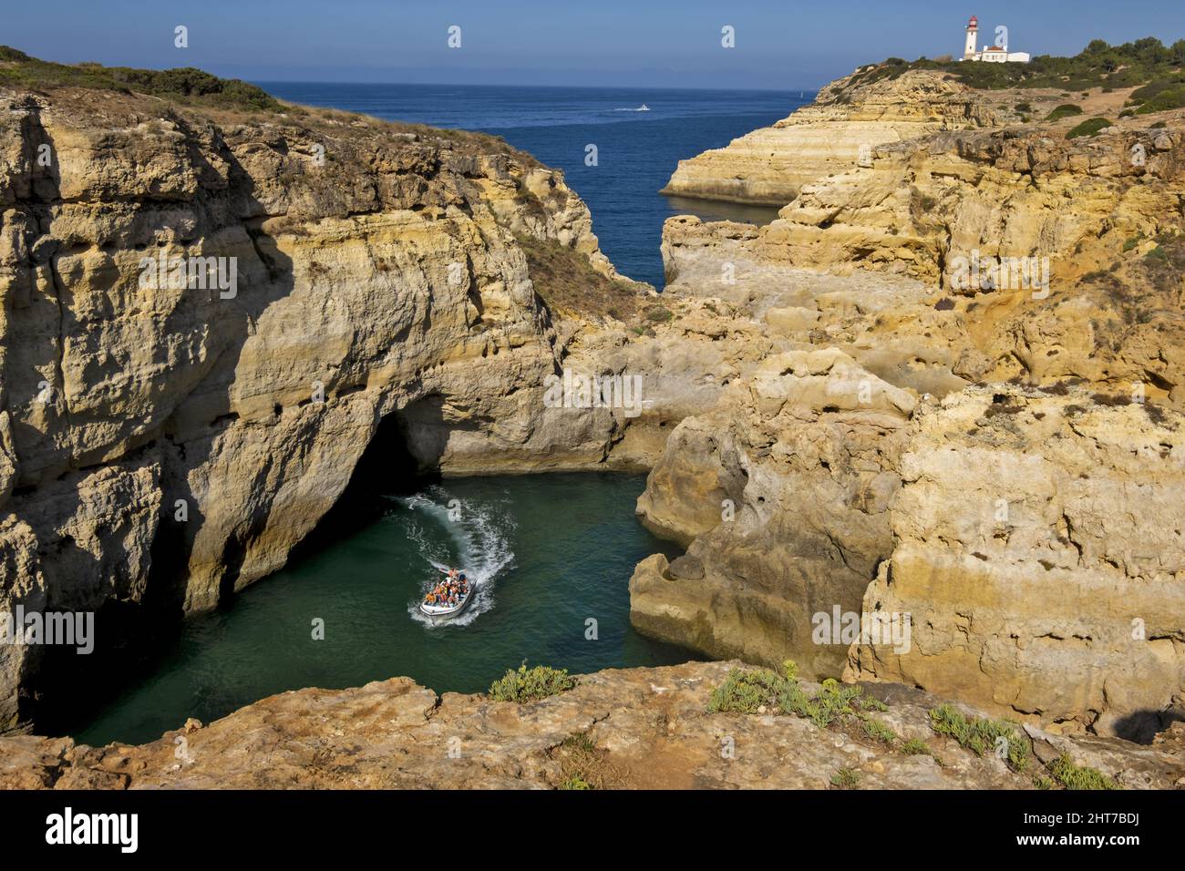 yellow cliff, sand and clear water at the Carvalho cape, Algarve ...