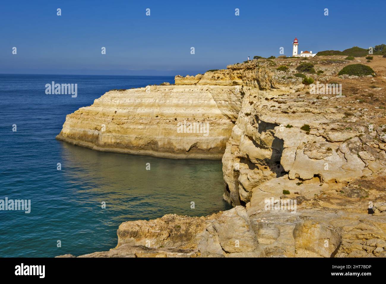 yellow cliff, sand and clear water at the Carvalho cape, Algarve ...