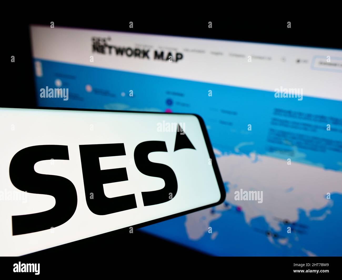Cellphone with logo of satellite telecommunications company SES S.A. on ...