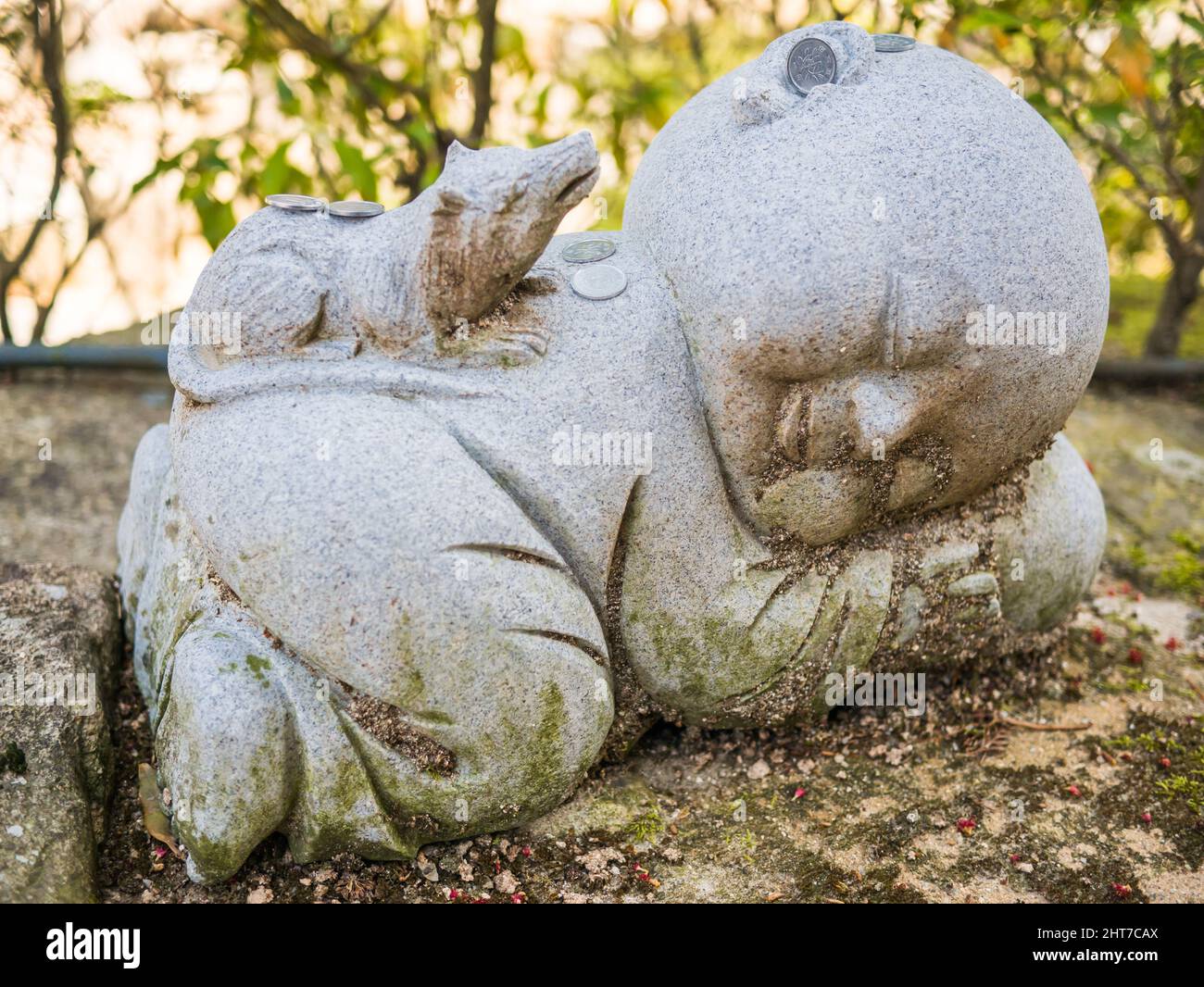 Closeup shot of sleeping baby monument in Daisho-in temple, Miyajima ...