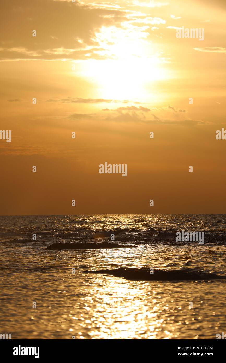 sunset in the evening over the sea High quality Stock Photo - Alamy