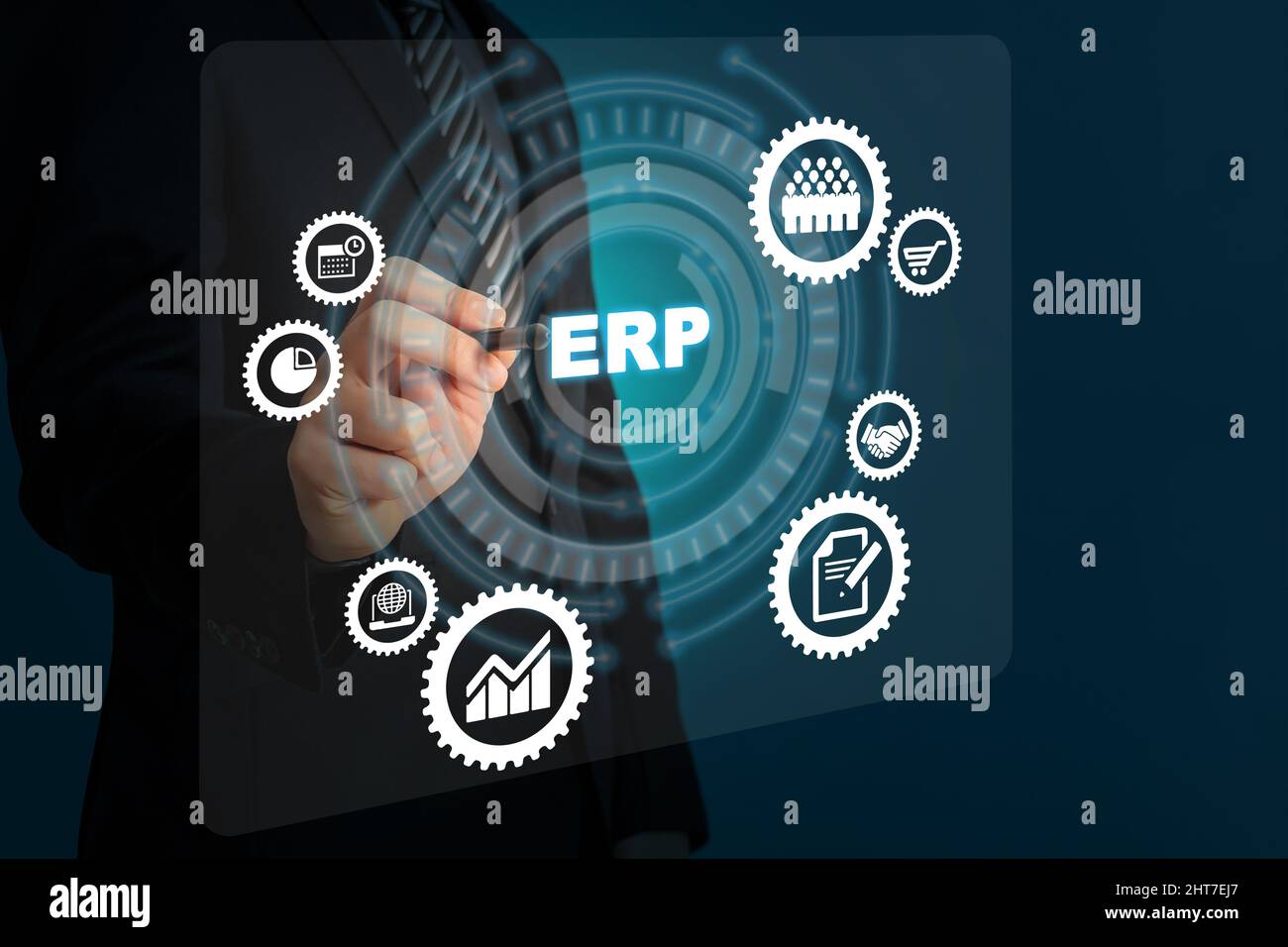 Businessman pointing at an icon of ERP- Enterprise resources planning ...