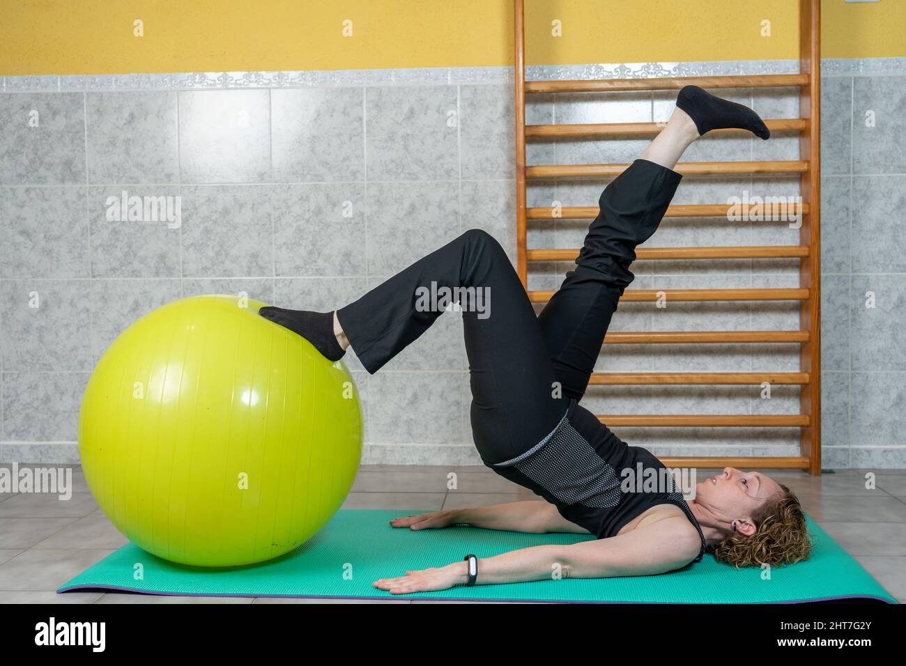 Spanish woman doing a ball exercise in a Physical therapy clinic Stock ...