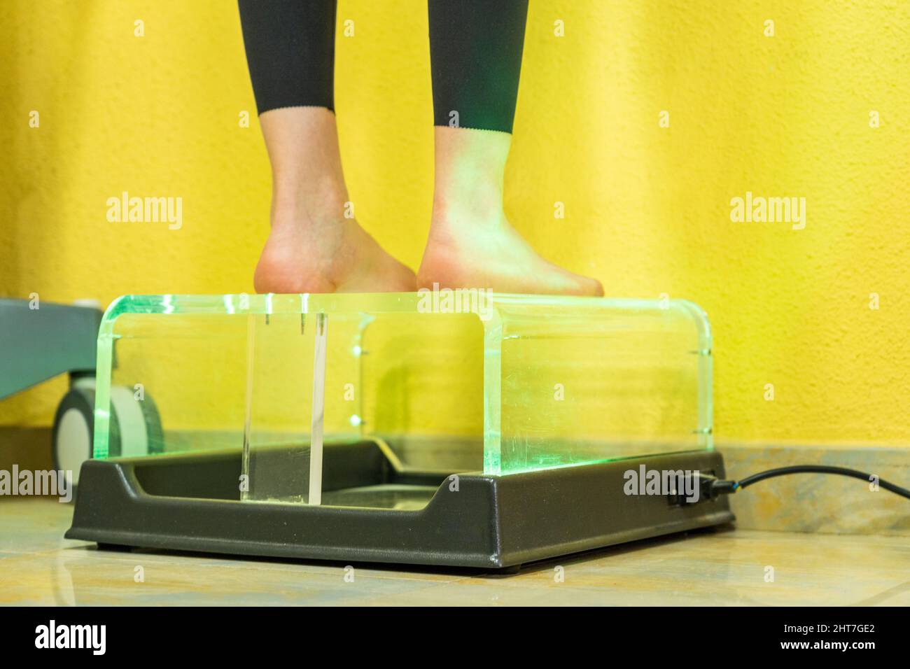 Female patient on a foot scanner in a podiatry clinic Stock Photo - Alamy