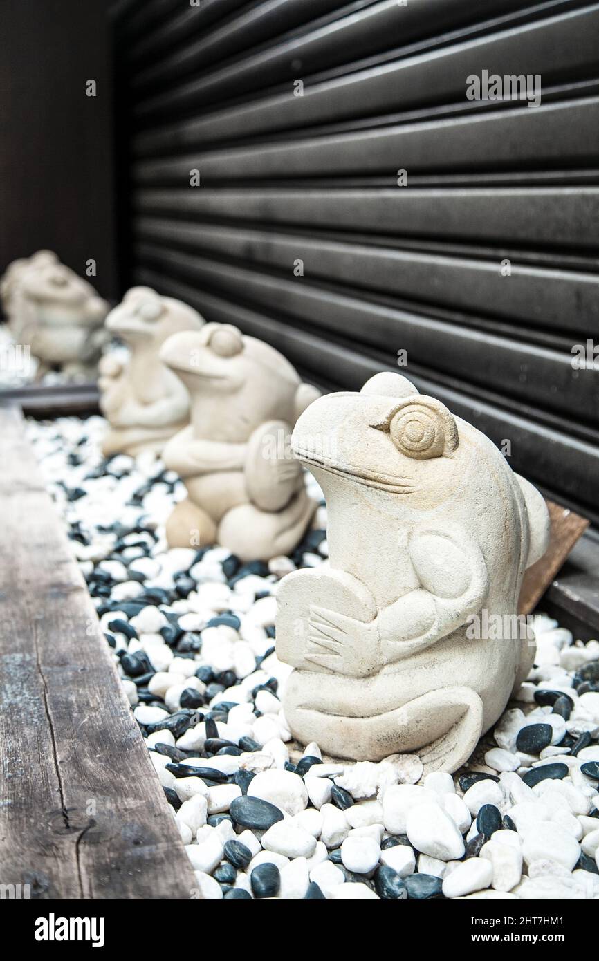 Vertical shot of small statues of frogs in Tokyo, Japan Stock Photo - Alamy