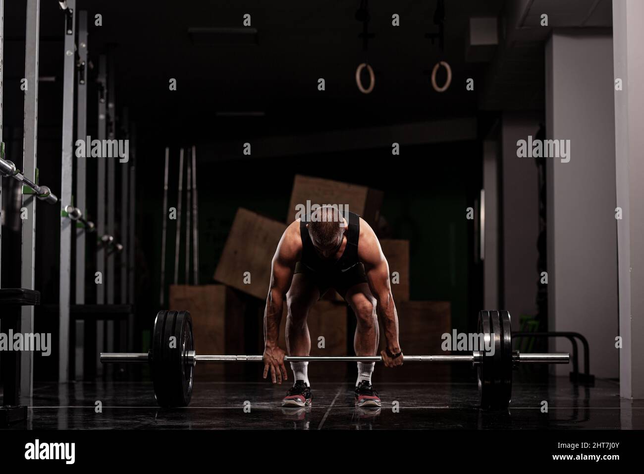 Muscular athlete lifting very heavy barbell Stock Photo - Alamy