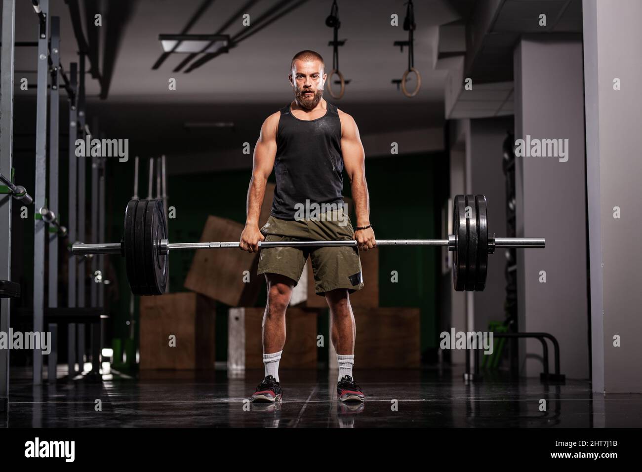 Muscular athlete lifting very heavy barbell Stock Photo - Alamy