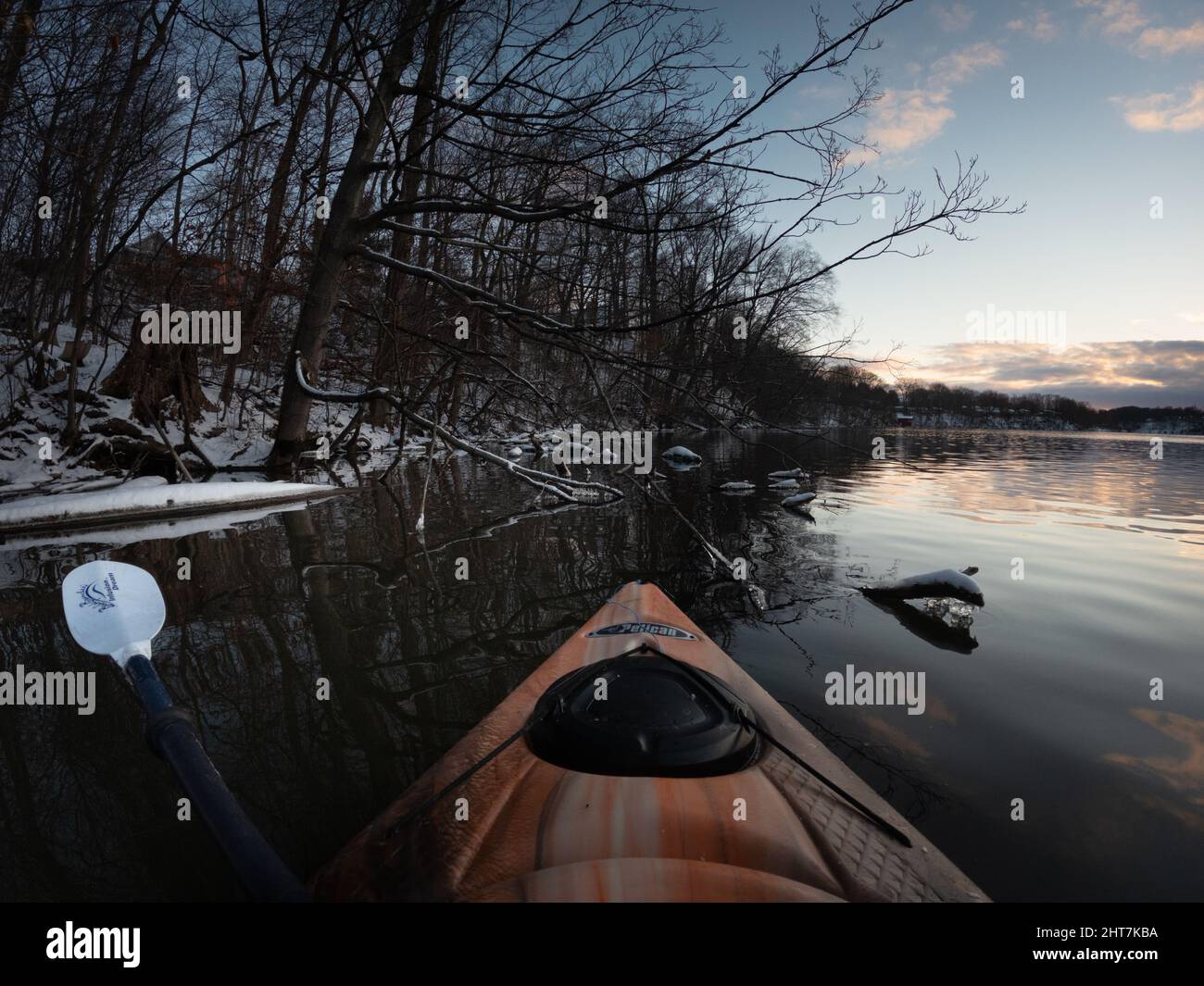 Winter kayaking on a Michigan lake near sunset Stock Photo - Alamy