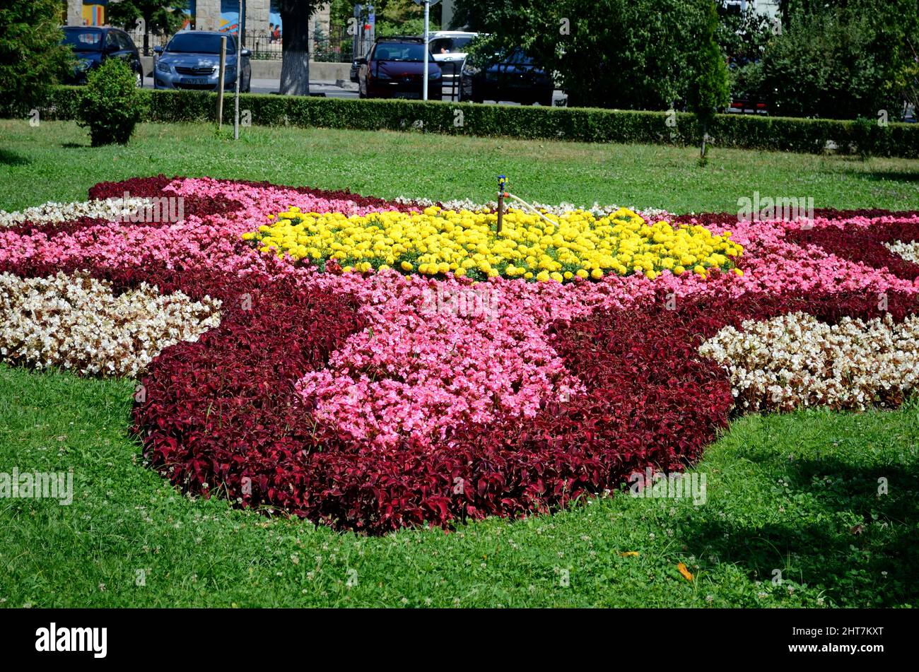 Flowers decoratively planted in a park next to a street Stock Photo - Alamy
