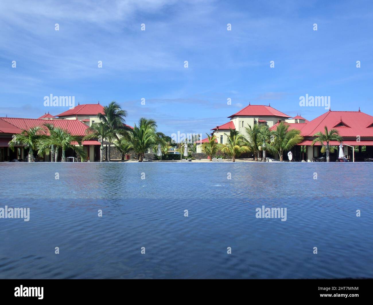 Resort with palm trees on the shore of Mauritius in East Africa Stock ...