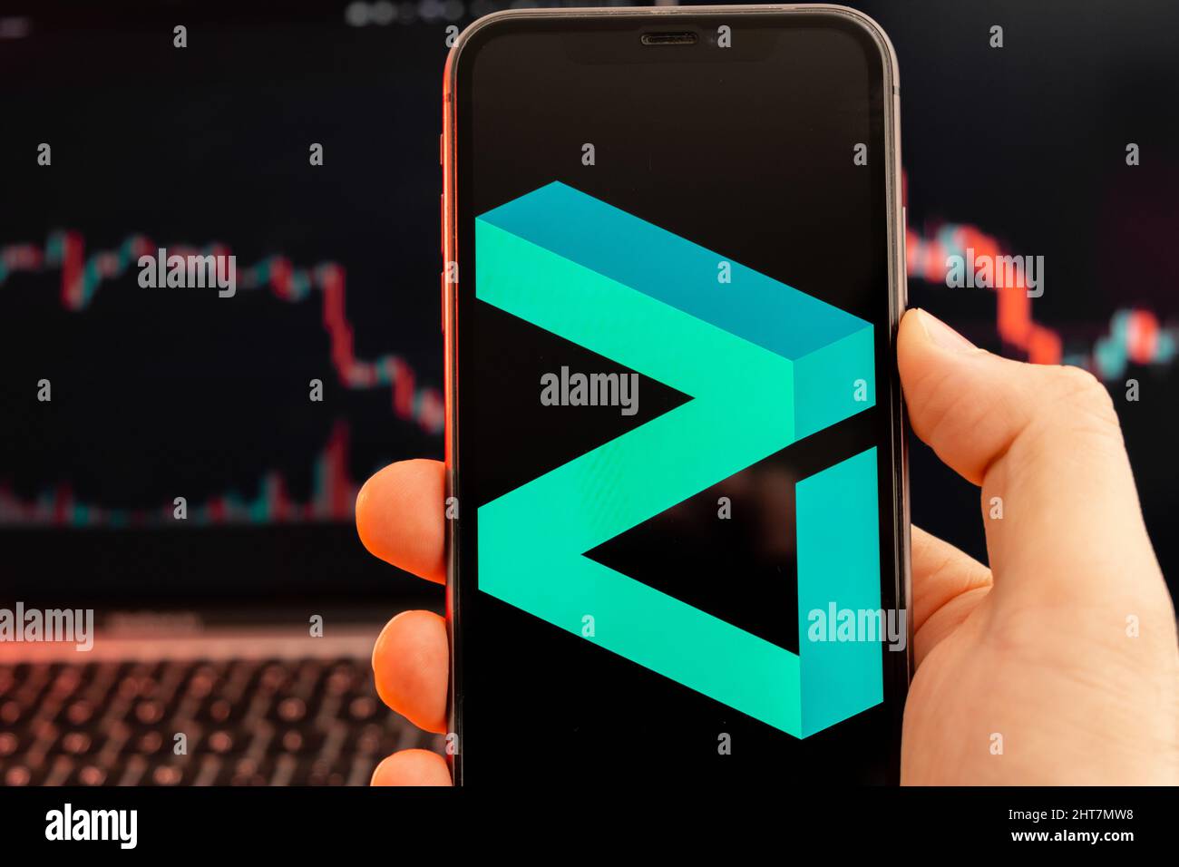 Zilliqa ZIL cryptocurrency logo on the screen of smartphone in mans ...