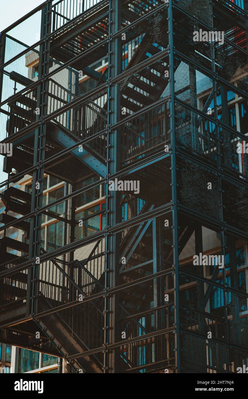 Vertical shot of a rusty steel fire escape on a building exterior in ...