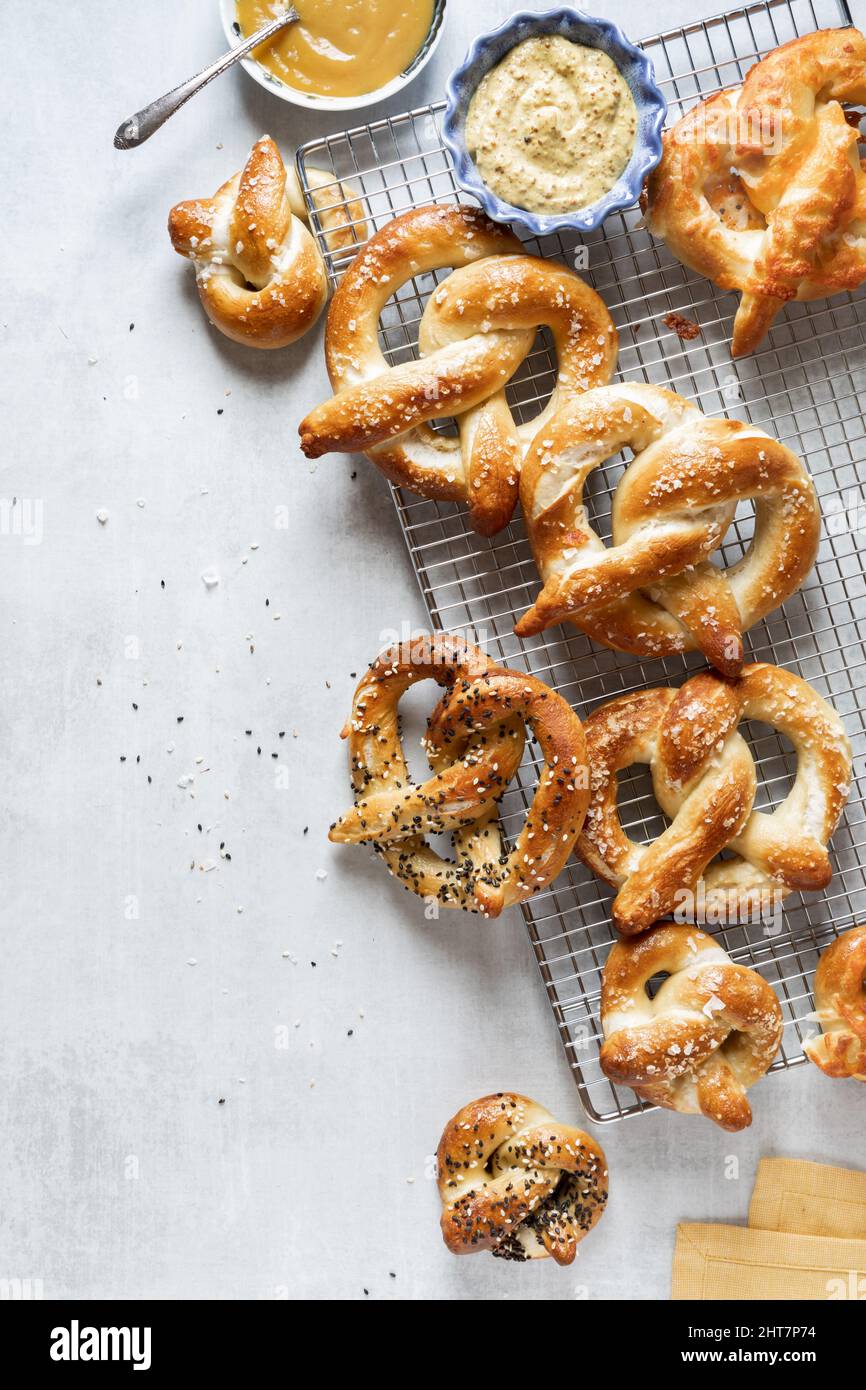Top down view of baked pretzels on a cooling rack with copy space to ...