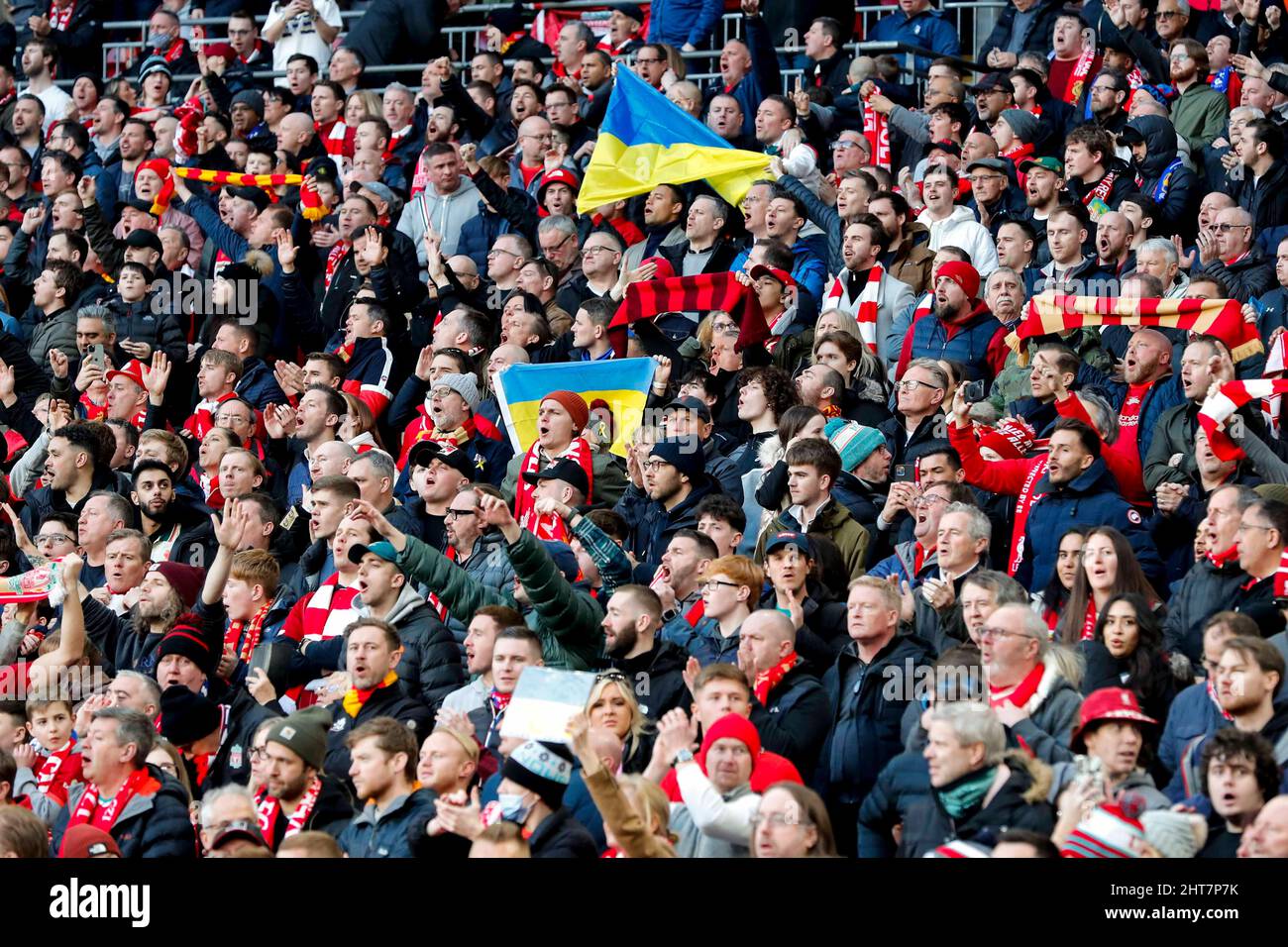 London, UK. 27th Feb, 2022. Liverpool fans wave Ukrainian flags before ...