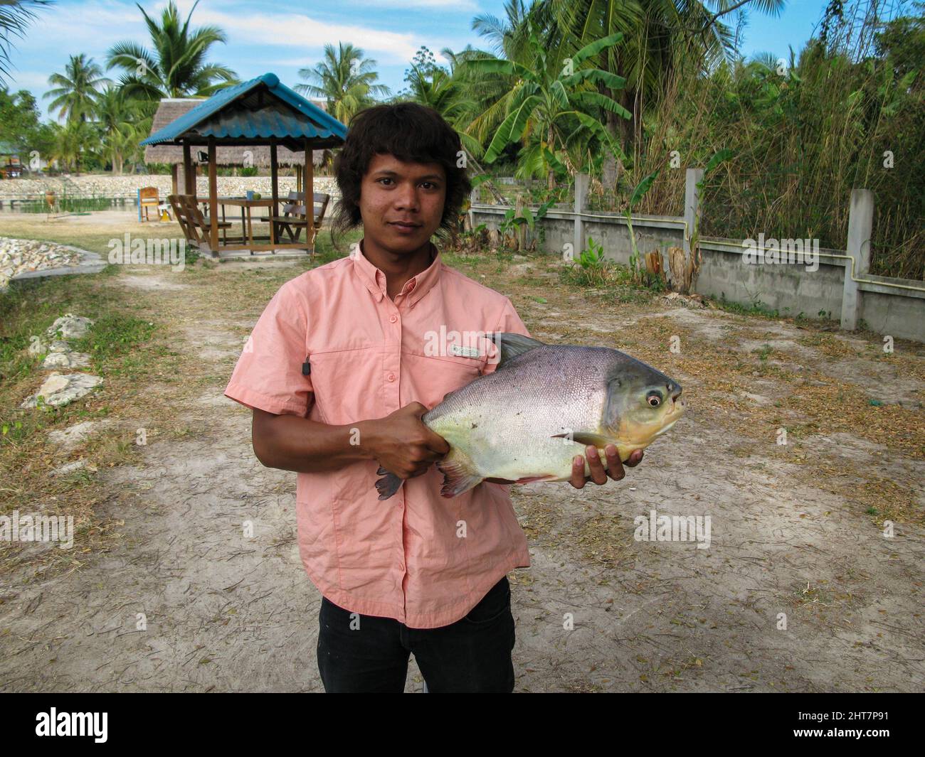 Boy holding big fish hi-res stock photography and images - Alamy
