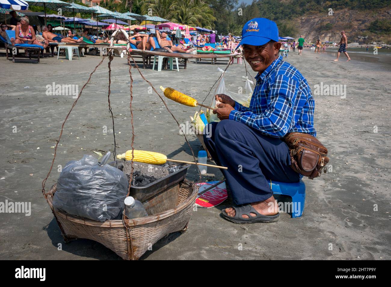 Man selling corn at the beach in Hua Hin, Thailand Stock Photo - Alamy
