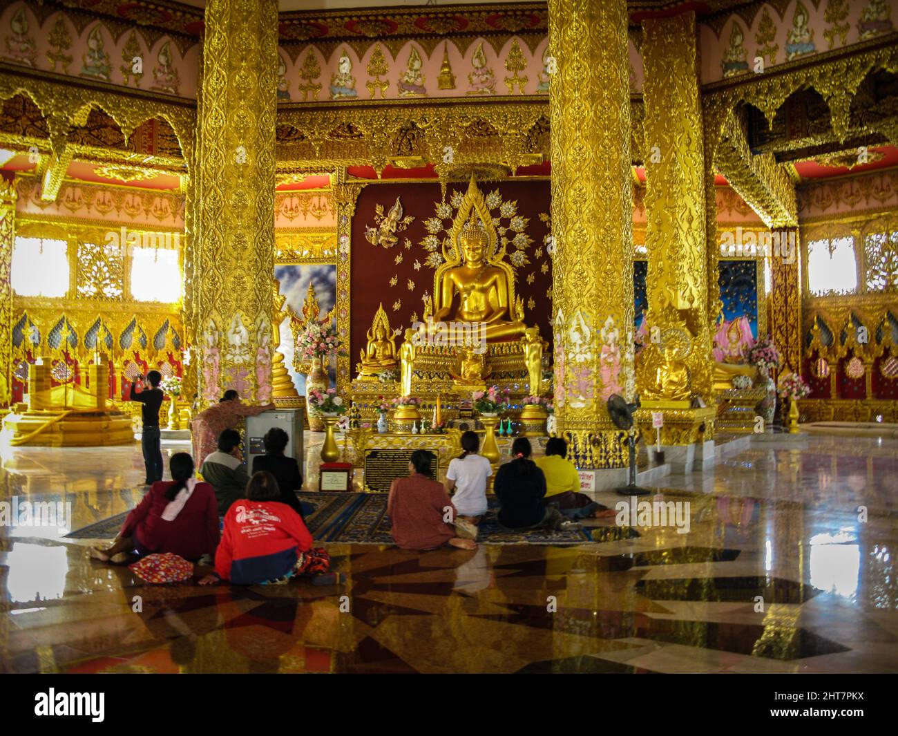 People inside of a Buddhism temple in Thailand Stock Photo - Alamy