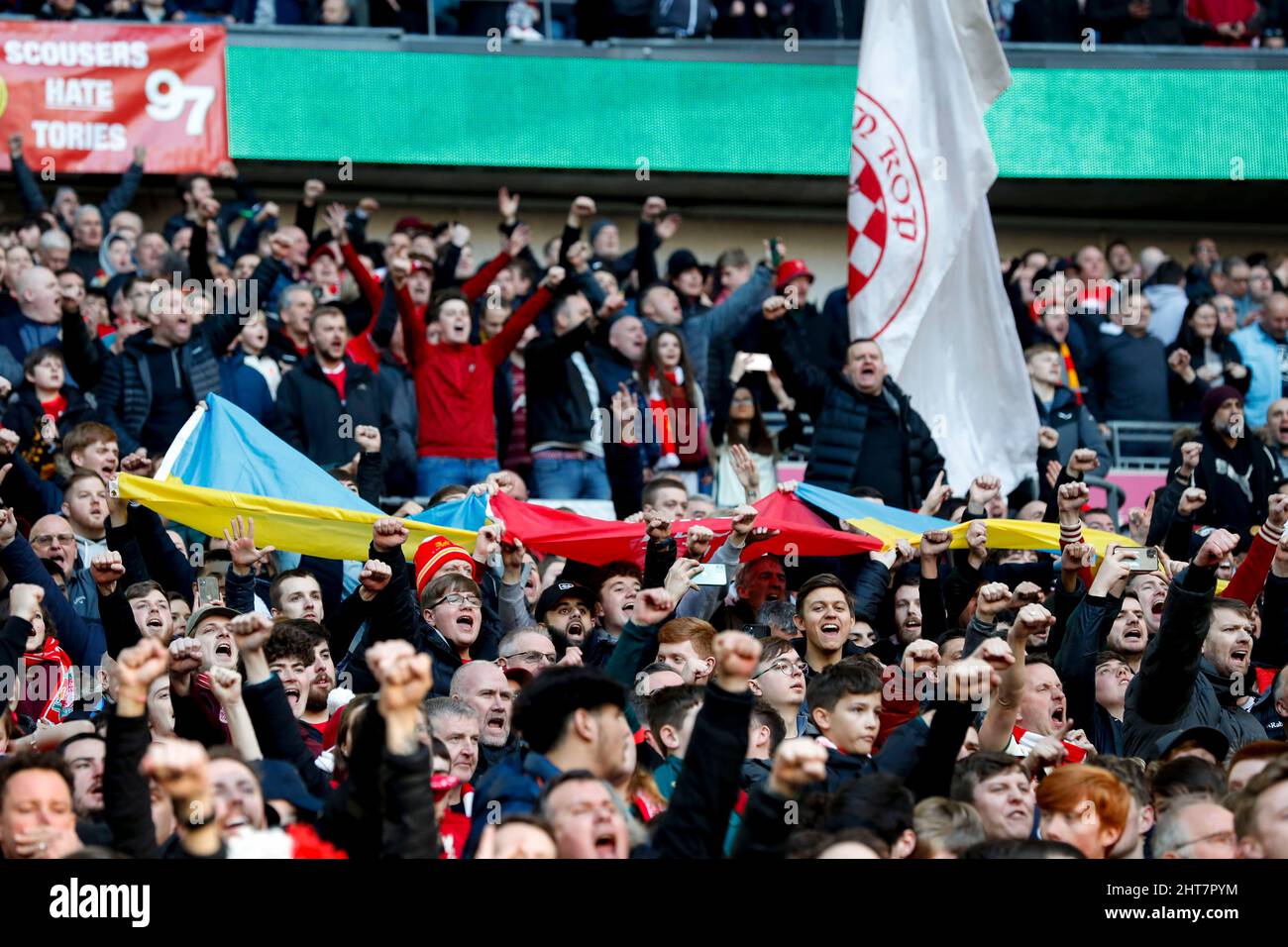 London, UK. 27th Feb, 2022. Liverpool fans wave Ukrainian flags before ...