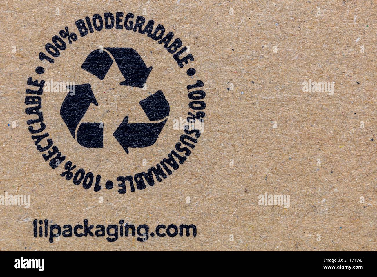 Recycling logo on cardboard packaging Stock Photo - Alamy