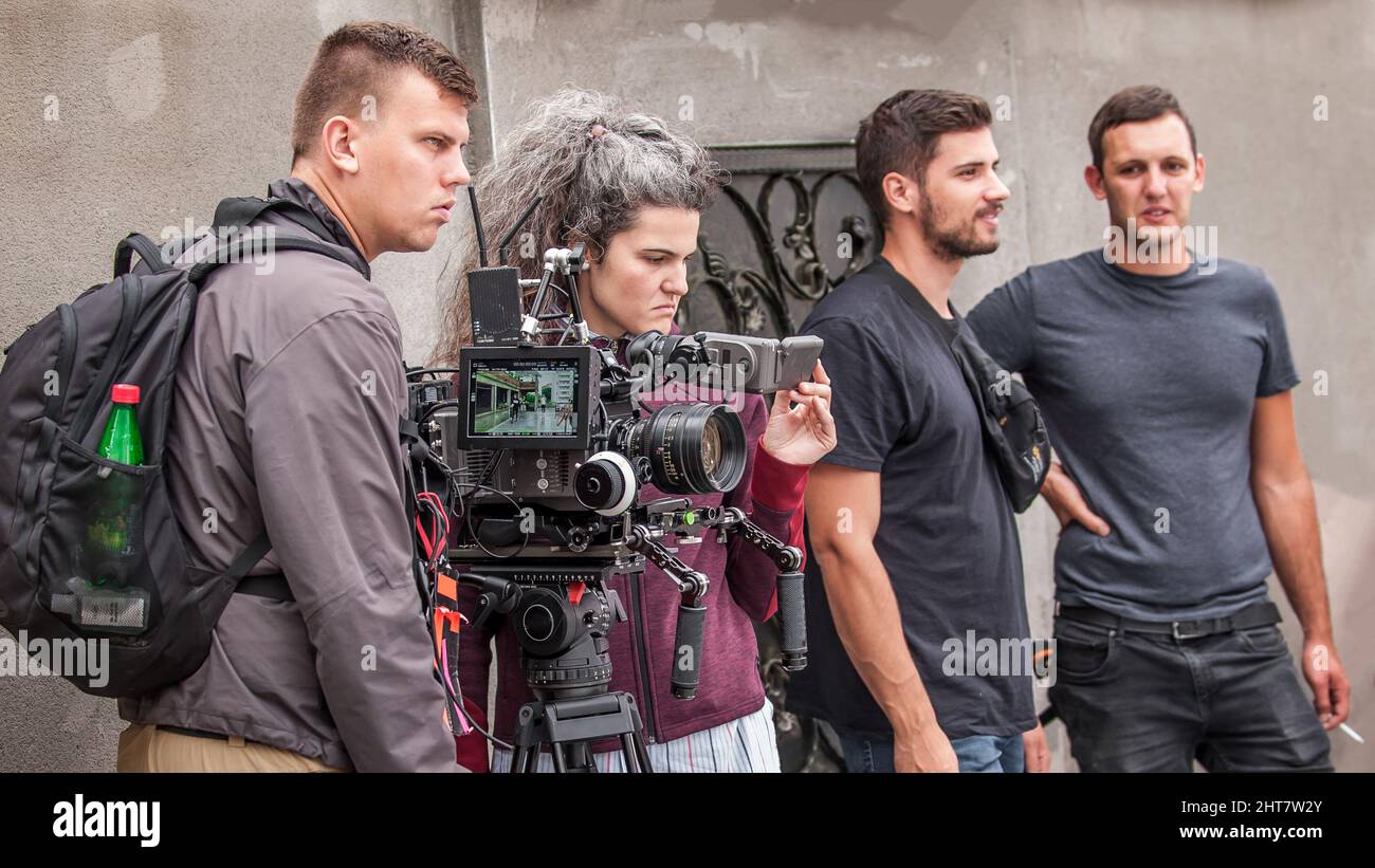 Behind the scenes. Film crew team shooting movie scene on outdoor ...