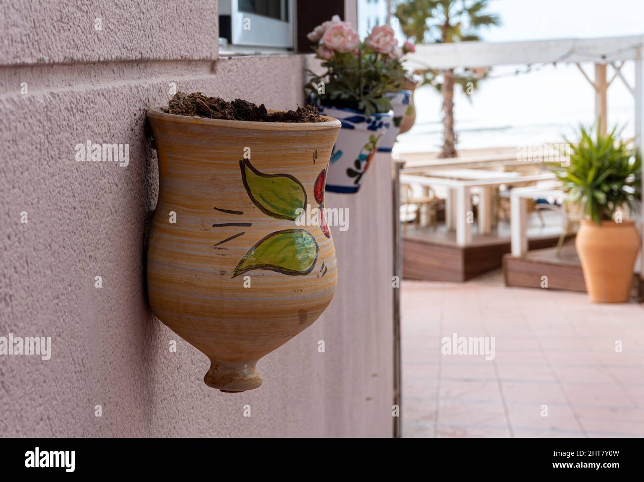 Beautiful flowers hanging on the wall Stock Photo - Alamy