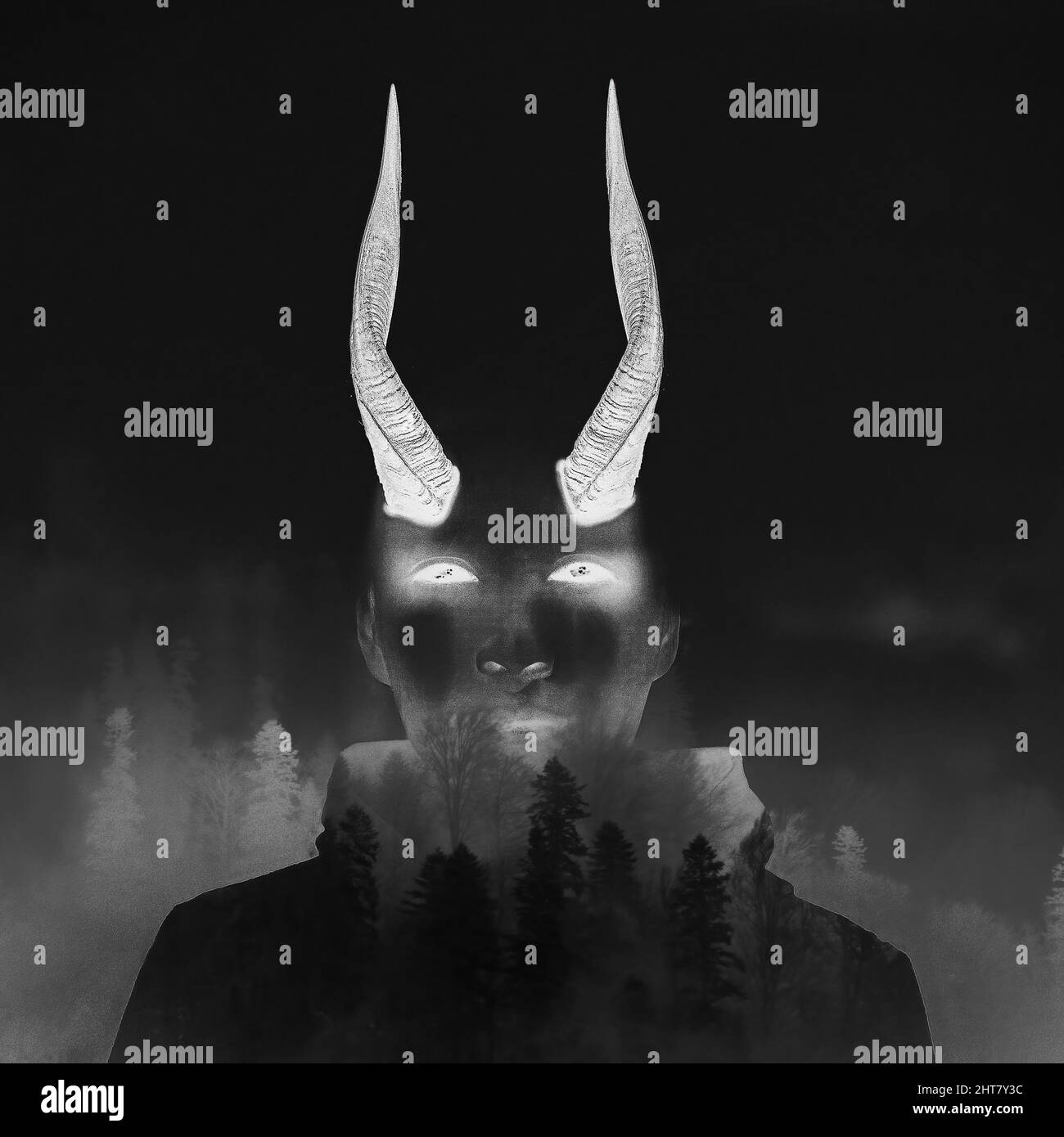Closeup shot of the satan human with illuminated eyes and horns ...
