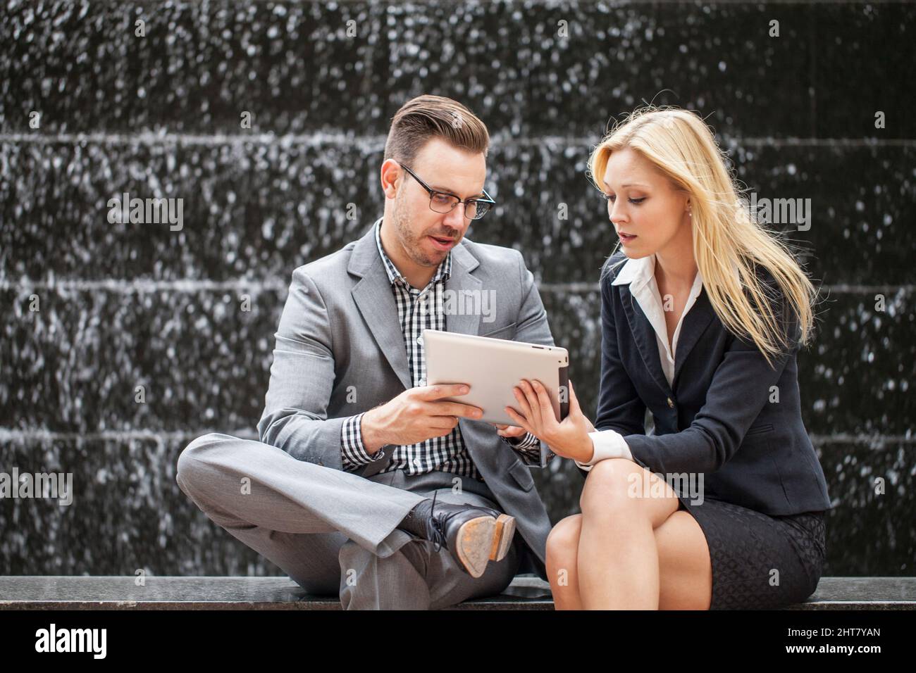 Sitting down together hi-res stock photography and images - Alamy