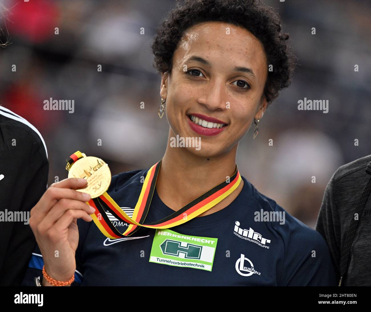 Leipzig, Germany. 27th Feb, 2022. Malaika Mihambo presents her gold ...