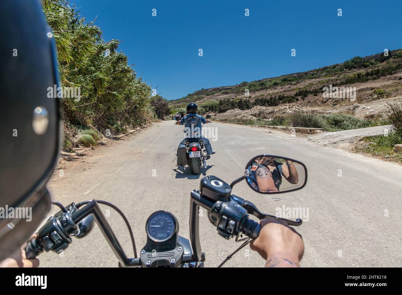 Motorcycle Riders ride down the road Stock Photo - Alamy