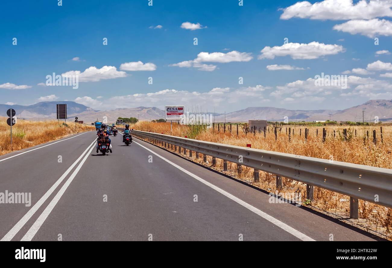 Motorcycle Riders ride down the road Stock Photo - Alamy