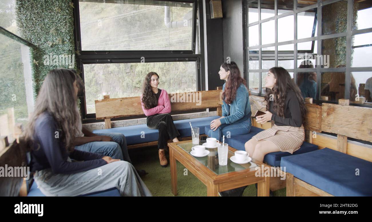Group of young South Asian ladies at a cafe Stock Photo - Alamy