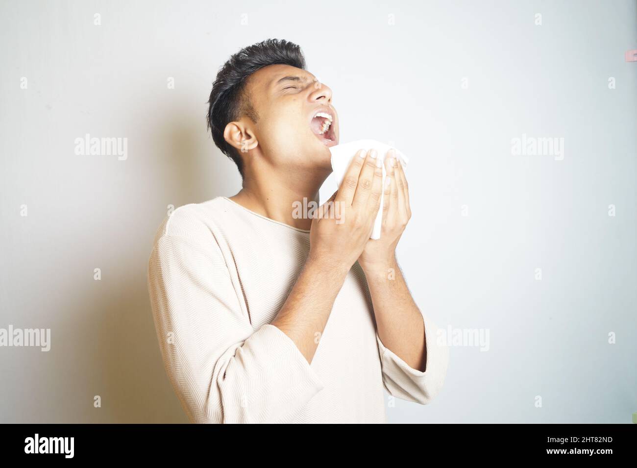 Indian man sneezing hi-res stock photography and images - Alamy