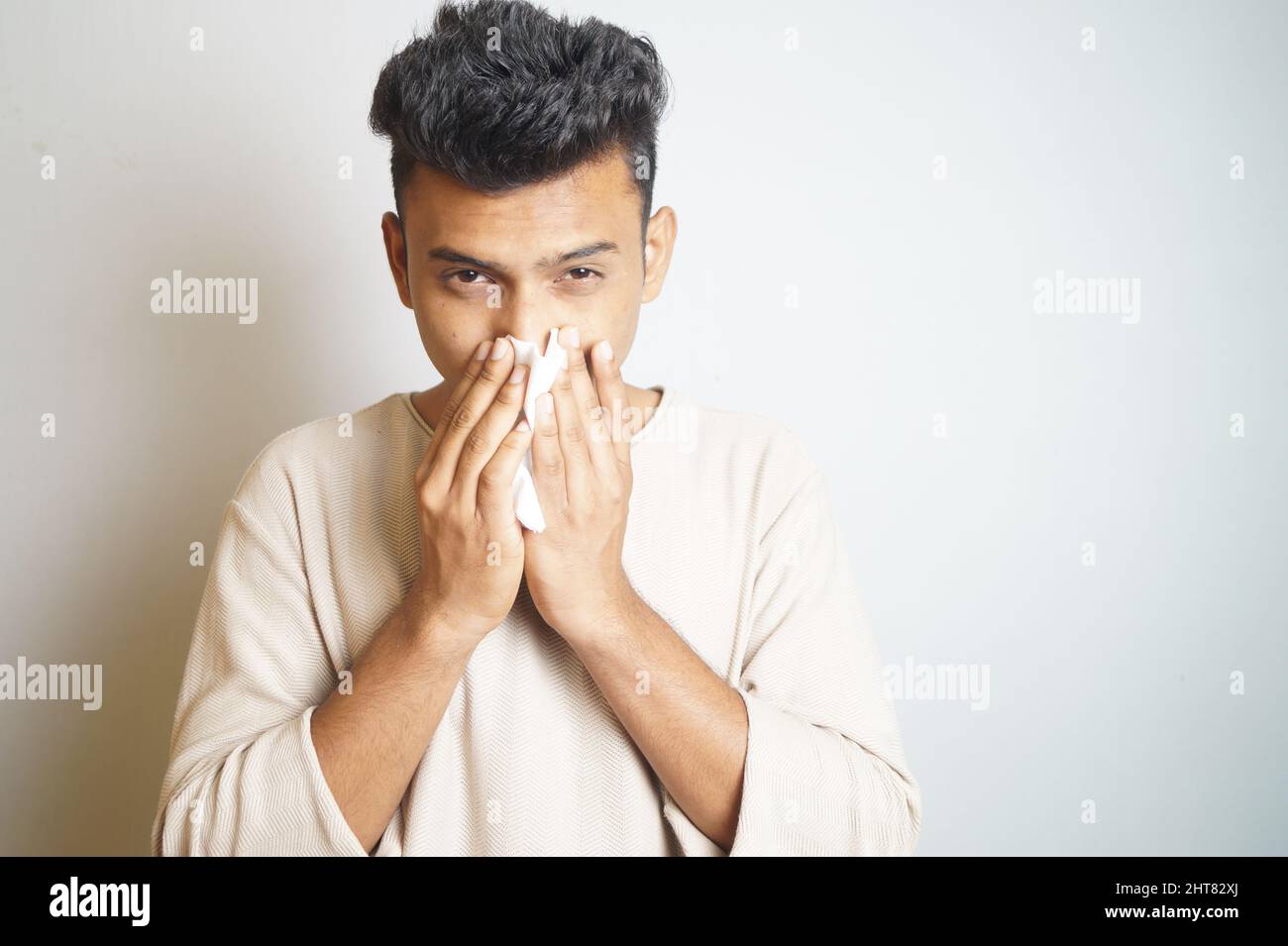 Indian man sneezing hi-res stock photography and images - Alamy