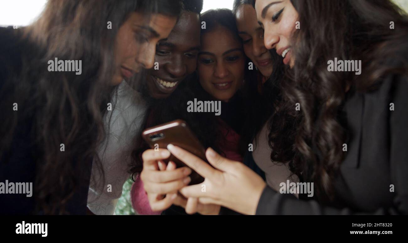 Indian female showing her friends something from her smartphone Stock ... Indian female showing her friends something from her smartphone Stock ...